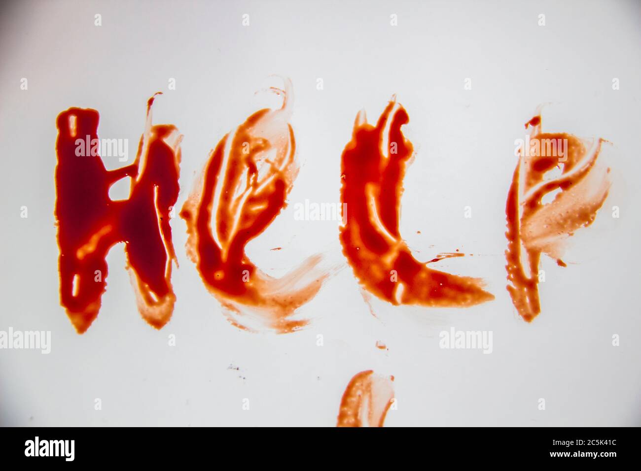 HELP written by blood. Bloody background with the inscription Stock ...