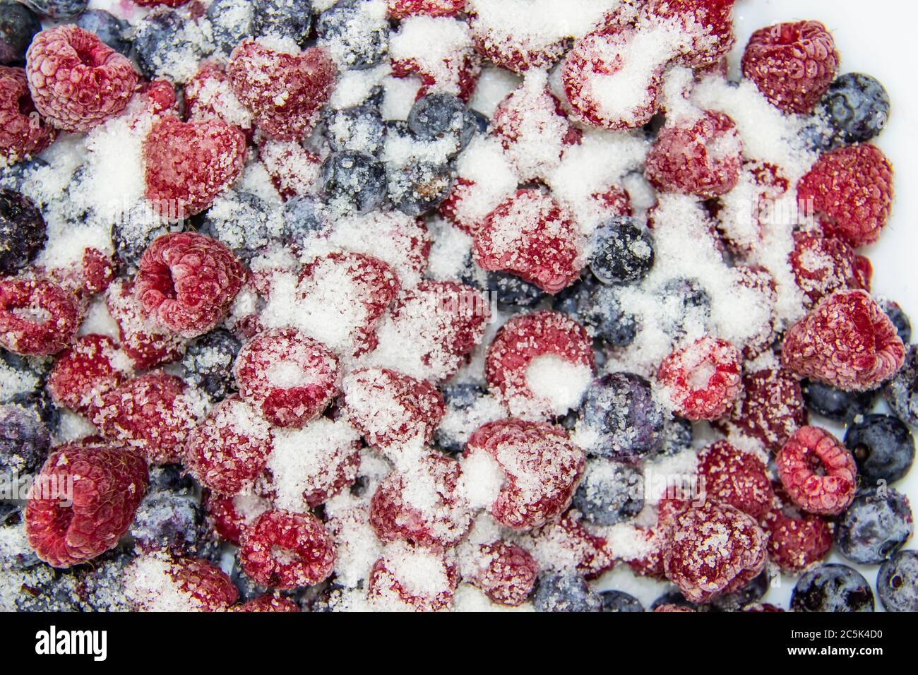 A Berry mix in sugar from frozen raspberries and blueberries. A Frozen ...
