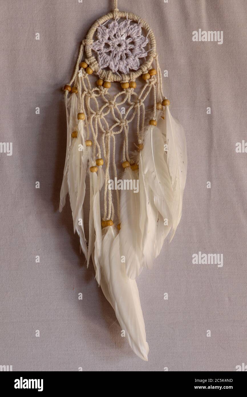 White color dream catcher with white feathers in the interior. Home ...
