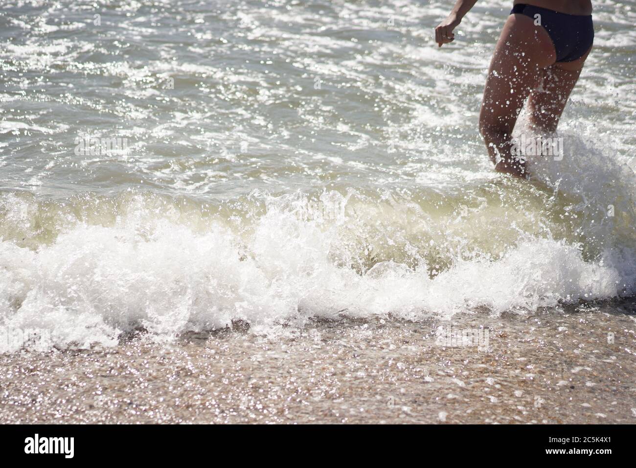 Wave crashing onto a beach hi-res stock photography and images - Alamy