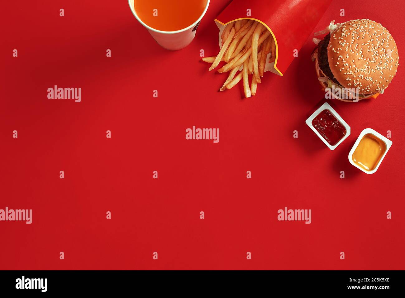 Fast food dish top view. Meat burger, potato chips and glass of drink ...