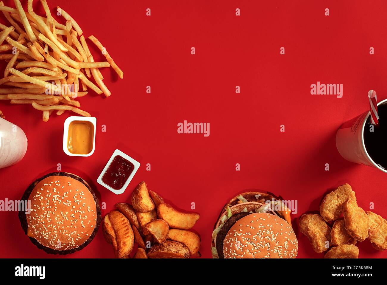 Fast food dish top view. Meat burger, potato chips and glass of drink ...