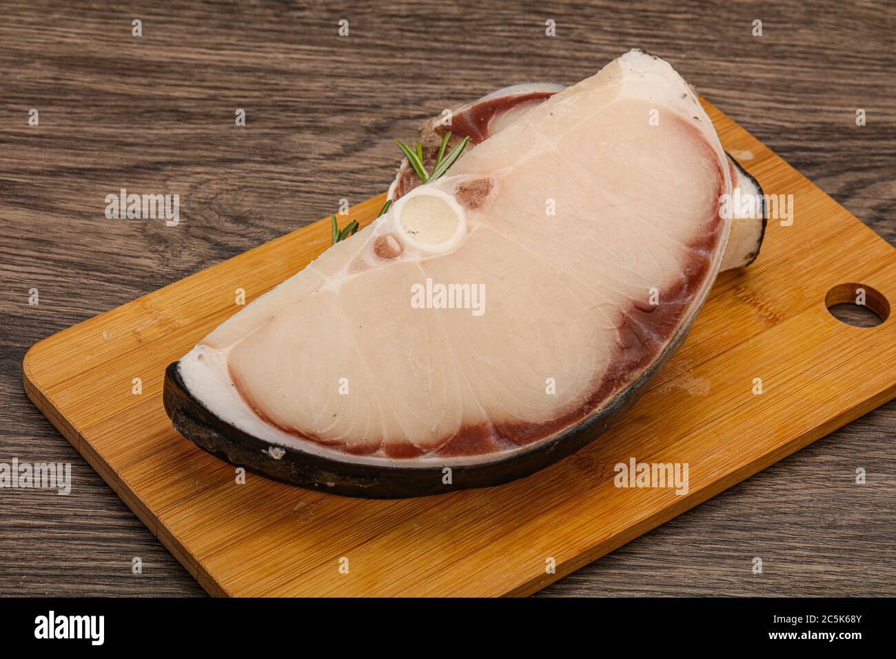 Raw shark steak served rosemary for cooking Stock Photo - Alamy