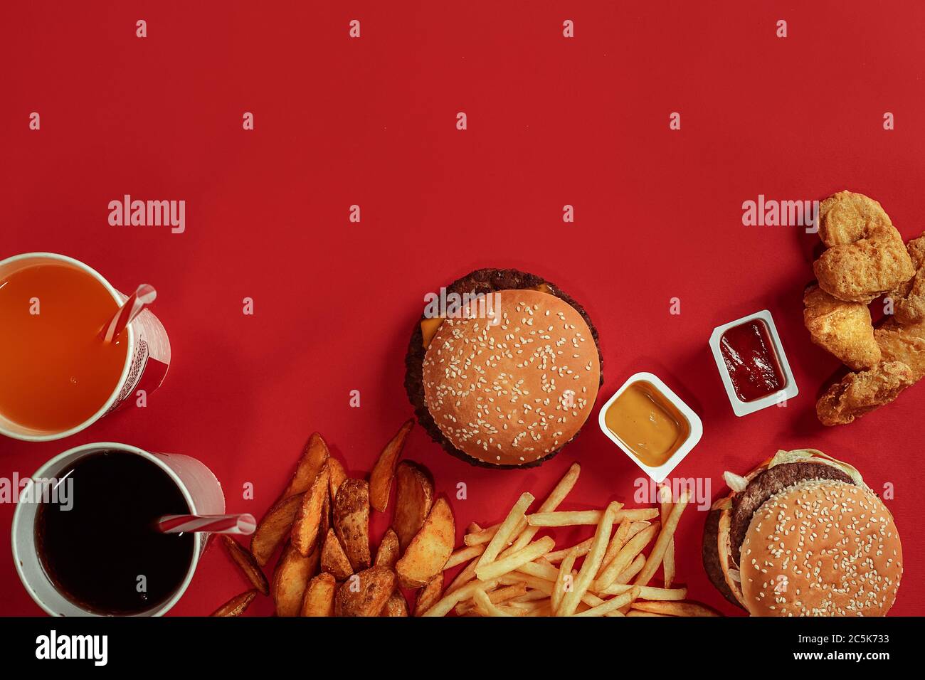 Fast food dish top view. Meat burger, potato chips and glass of drink ...