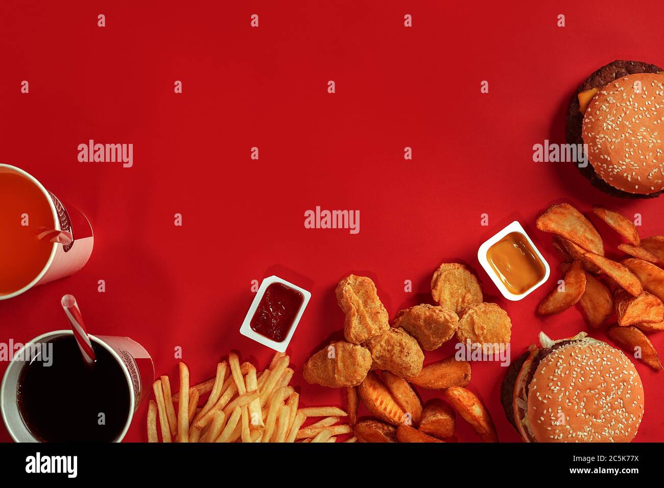 Fast food dish top view. Meat burger, potato chips and glass of drink ...