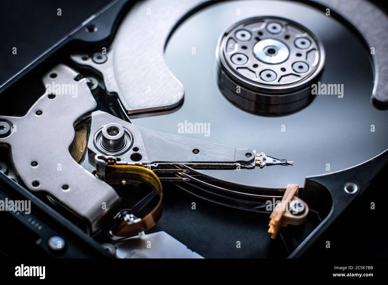 Closeup of head cylinder in hard disk drive on dark background Stock ...