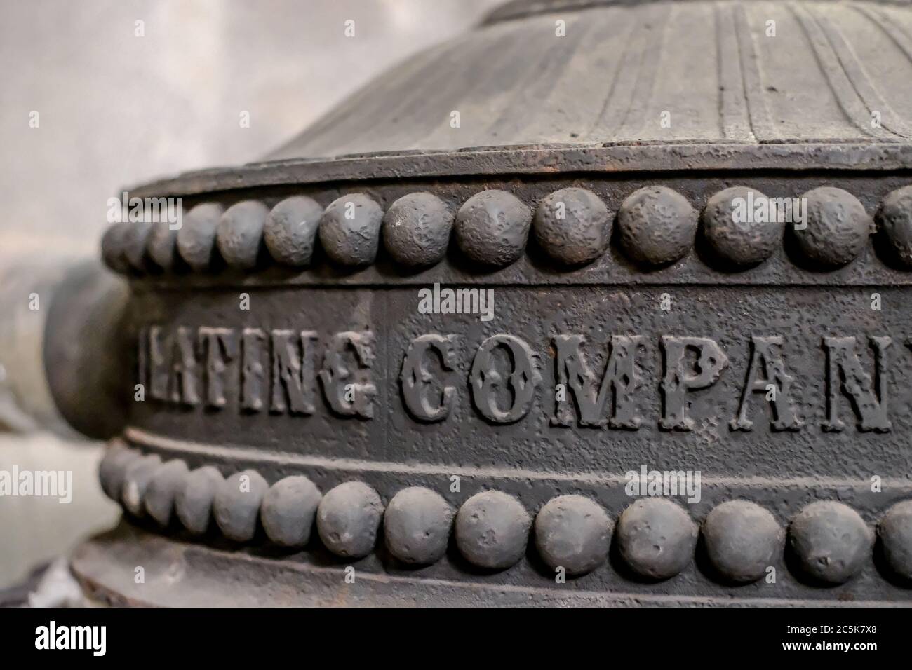 lose-up view of a very old, cast-iron gas fired boiler used to heat a ...