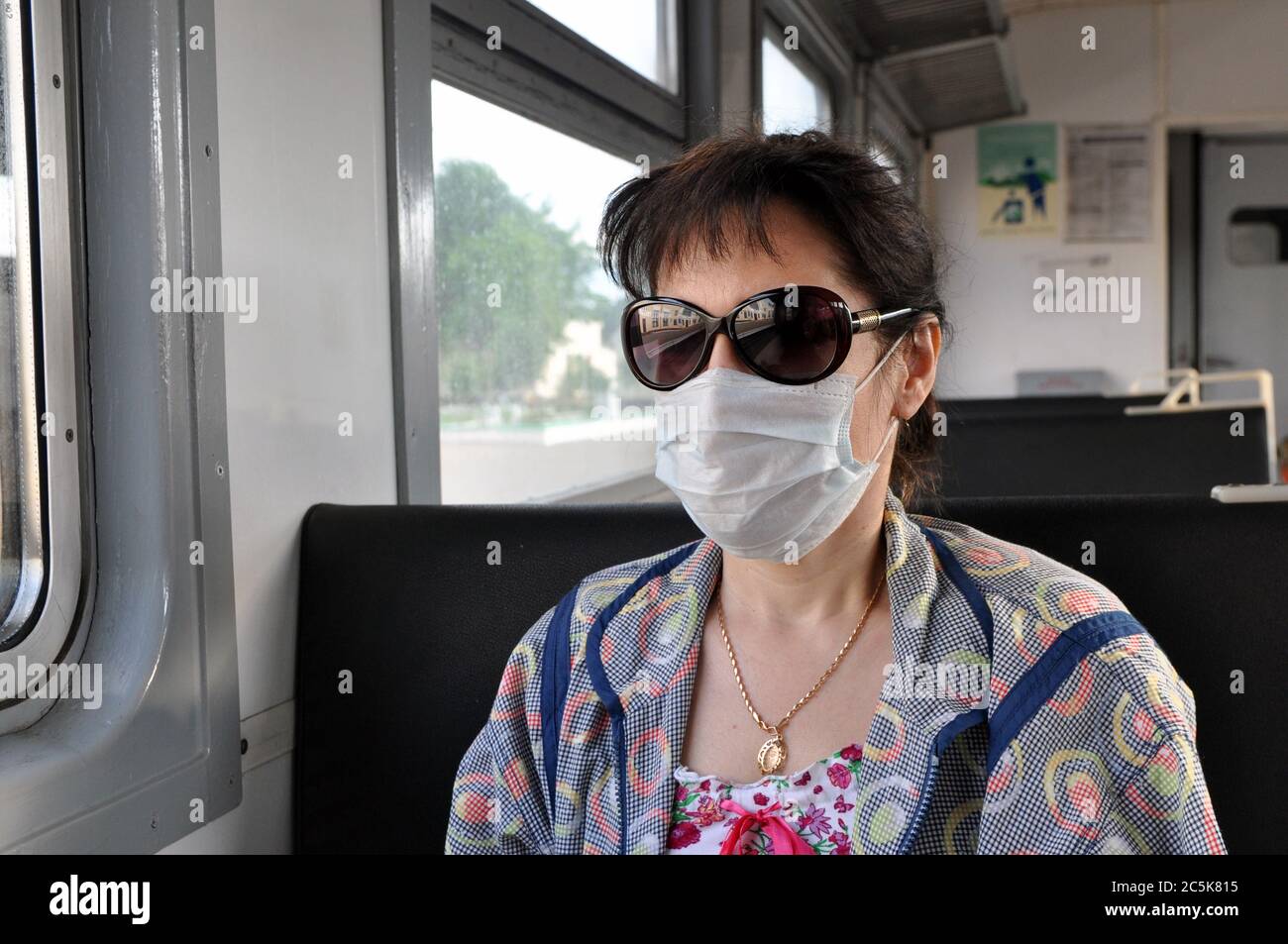 Woman in medical mask rides hi-res stock photography and images - Alamy