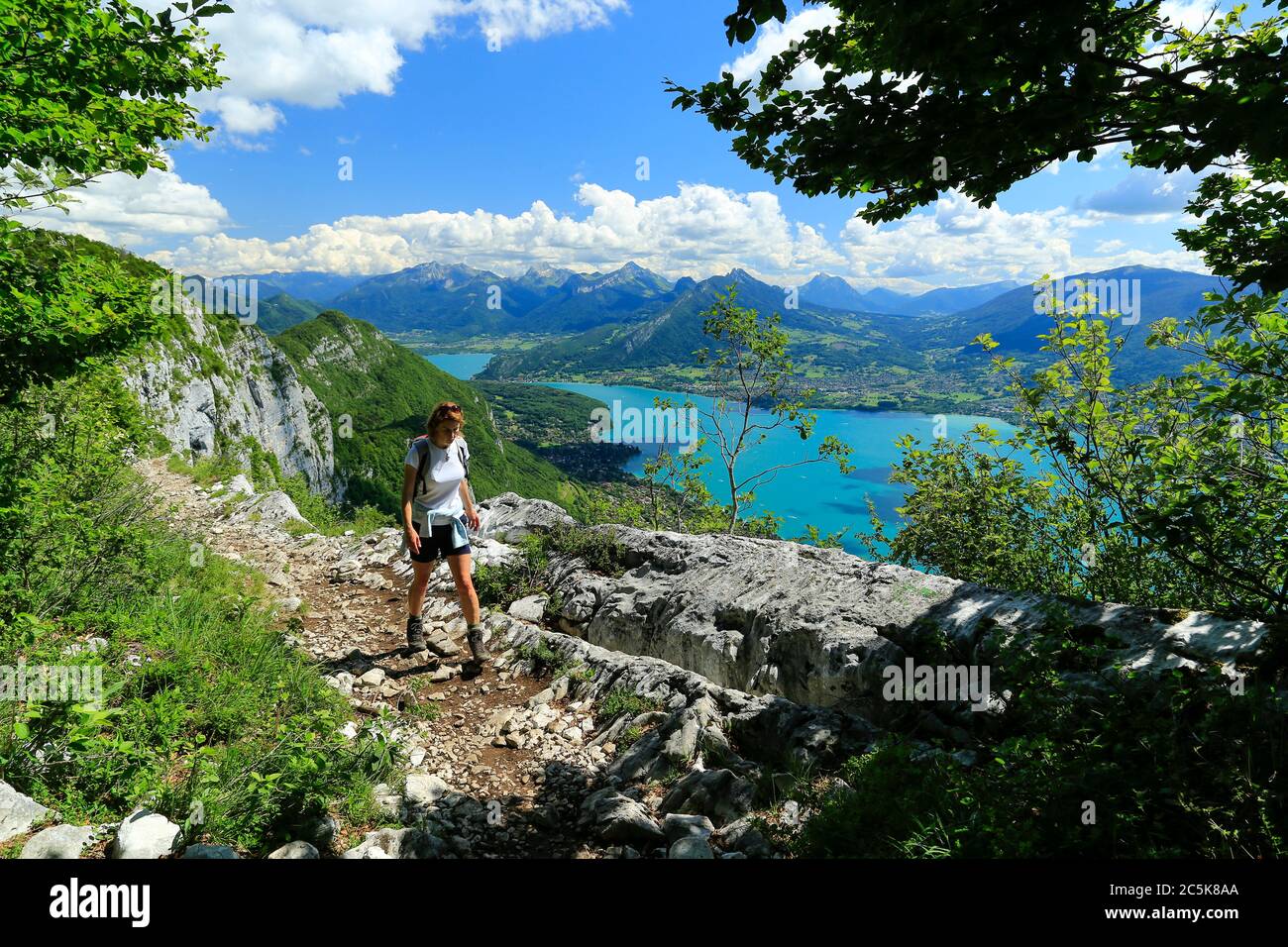 Female walker, hiking in the French Alps above lake Annecy Stock Photo ...