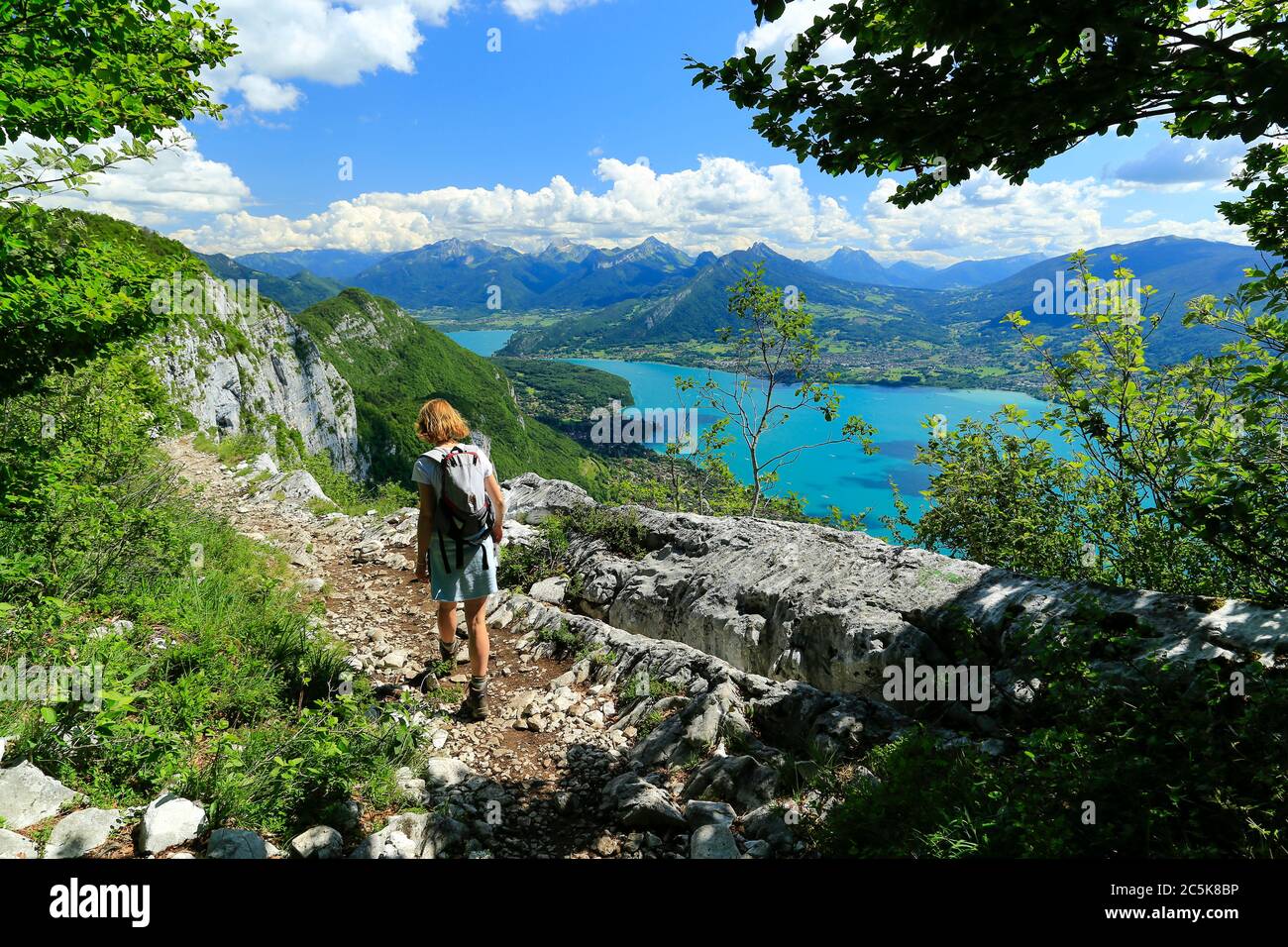 Female walker, hiking in the French Alps above lake Annecy Stock Photo ...