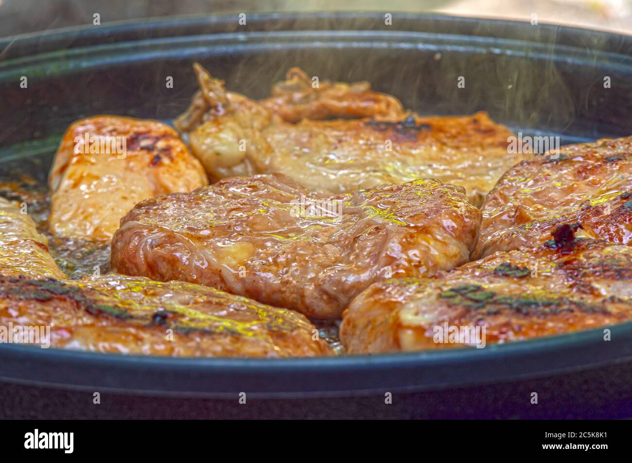 Cooking in electric meat grill close up Stock Photo - Alamy