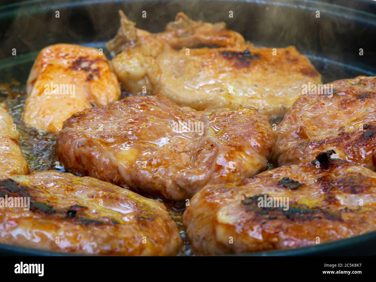 Cooking in electric meat grill close up Stock Photo - Alamy