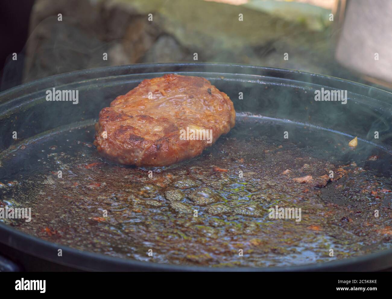 Cooking in electric meat grill close up Stock Photo - Alamy