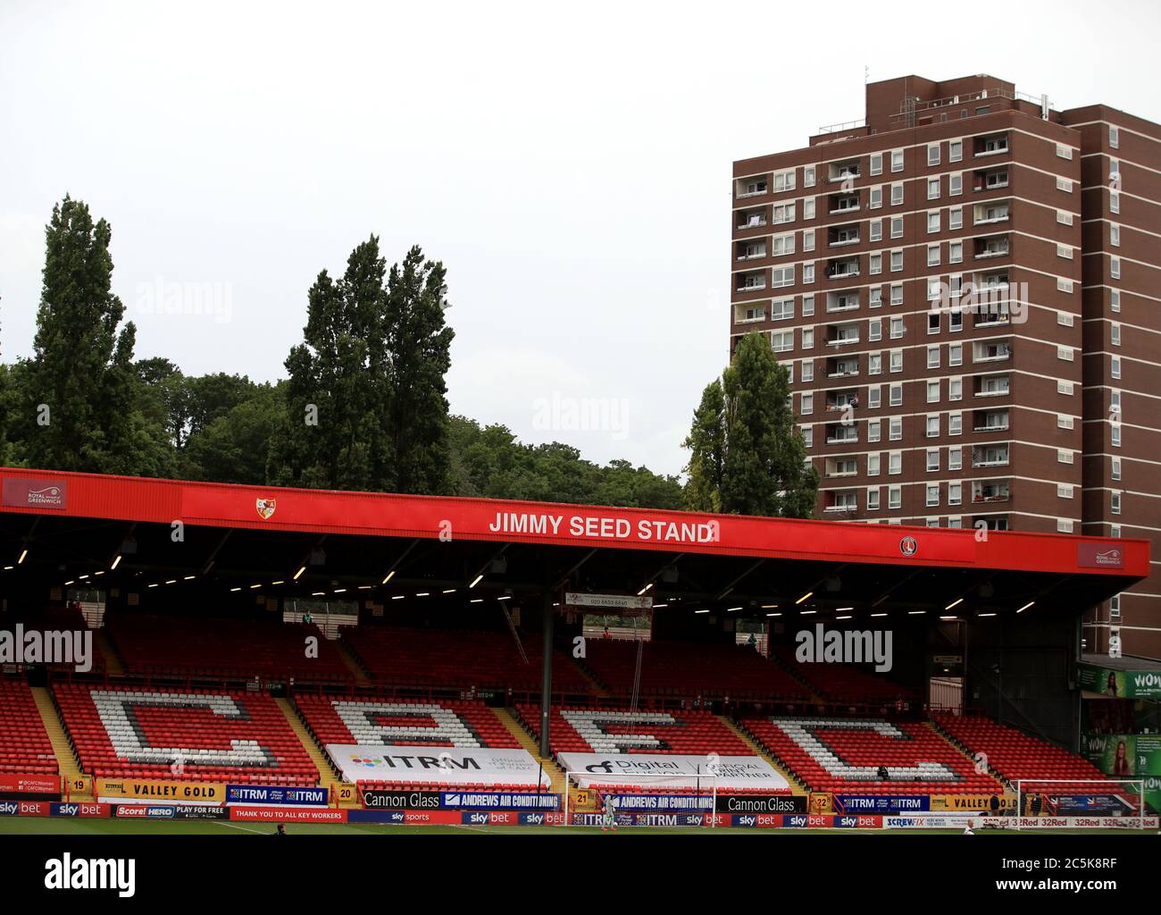 Advertising boards, banners and flags at The Valley, London Stock Photo ...