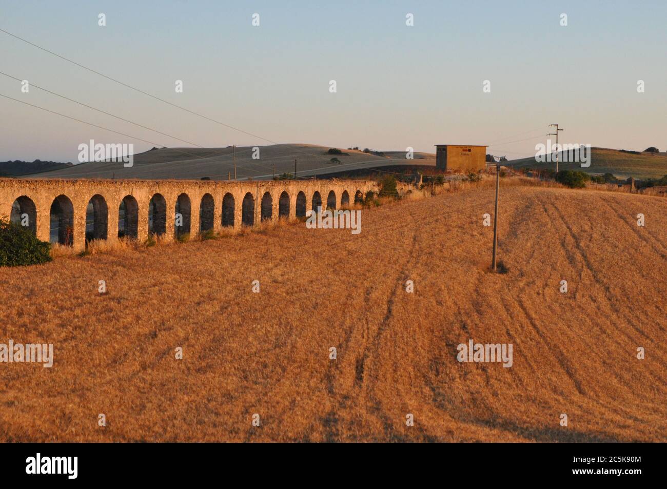 roman aqueduct ruins in monte romano italy at sunset Stock Photo - Alamy