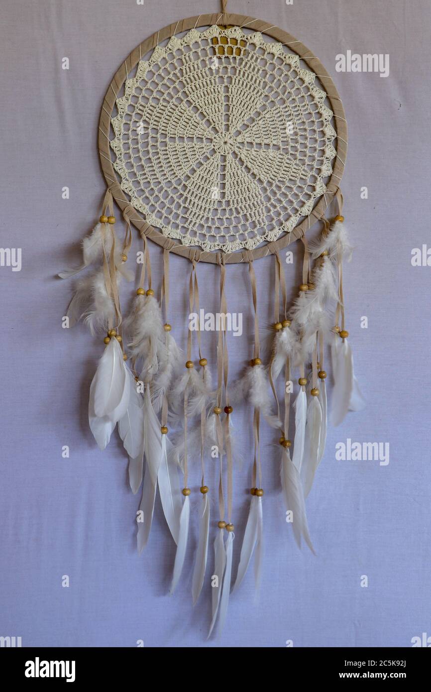 White color dream catcher with white feathers in the interior. Home ...
