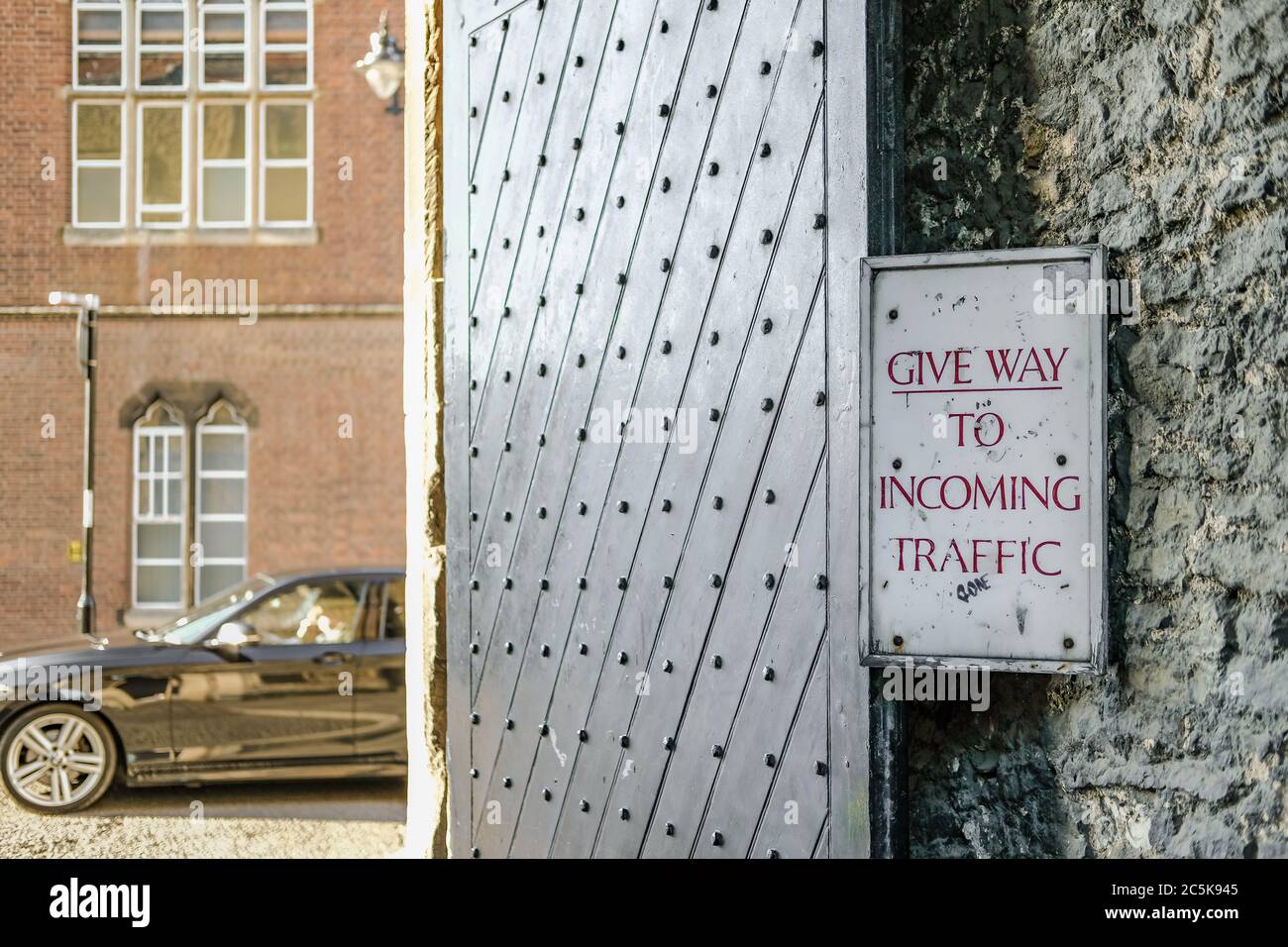 Old Give Way sign seen at the exit to a famous private school. The ...