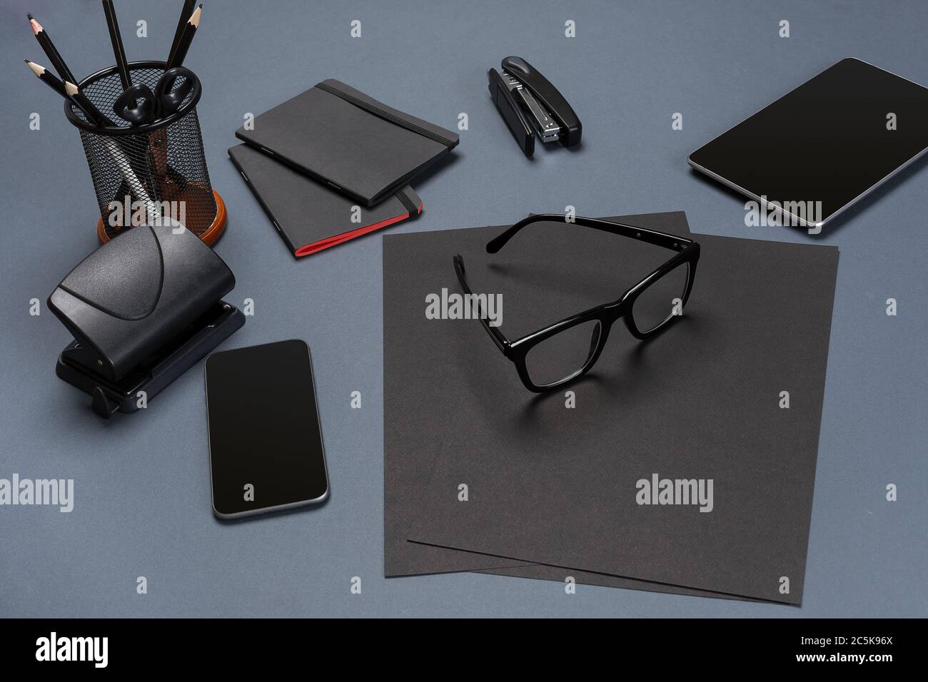 Black office stuff collection flat lay. Top view on set of stationery ...