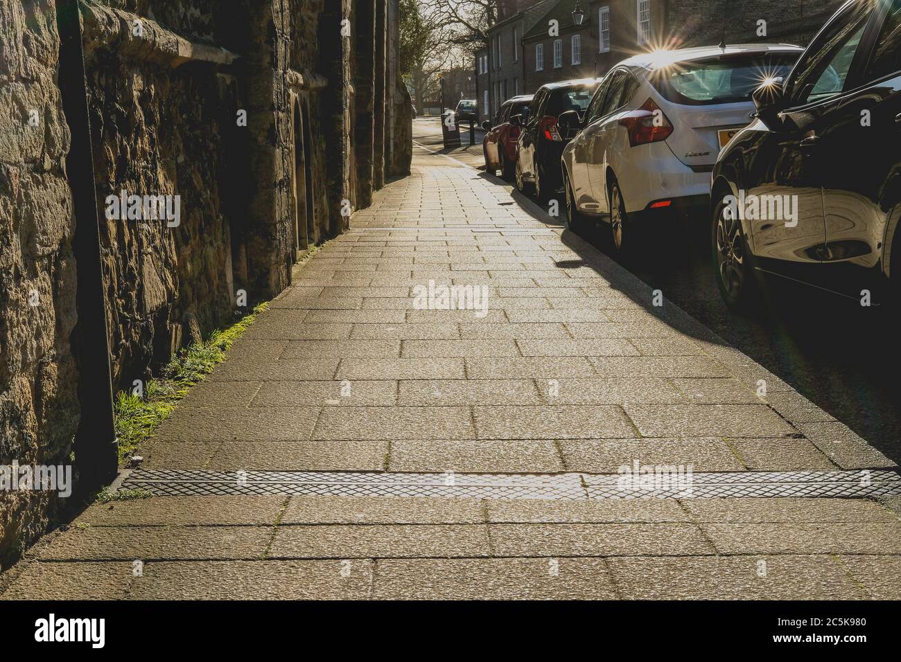 High contrast, low level view of a typical pavement seen down a one way ...