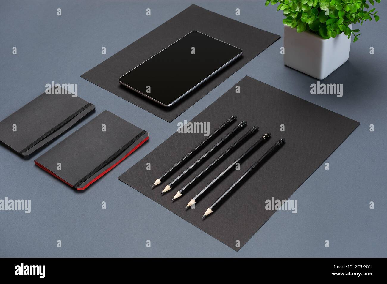Modern mock up flat lay of notebook and stationery on gray background ...