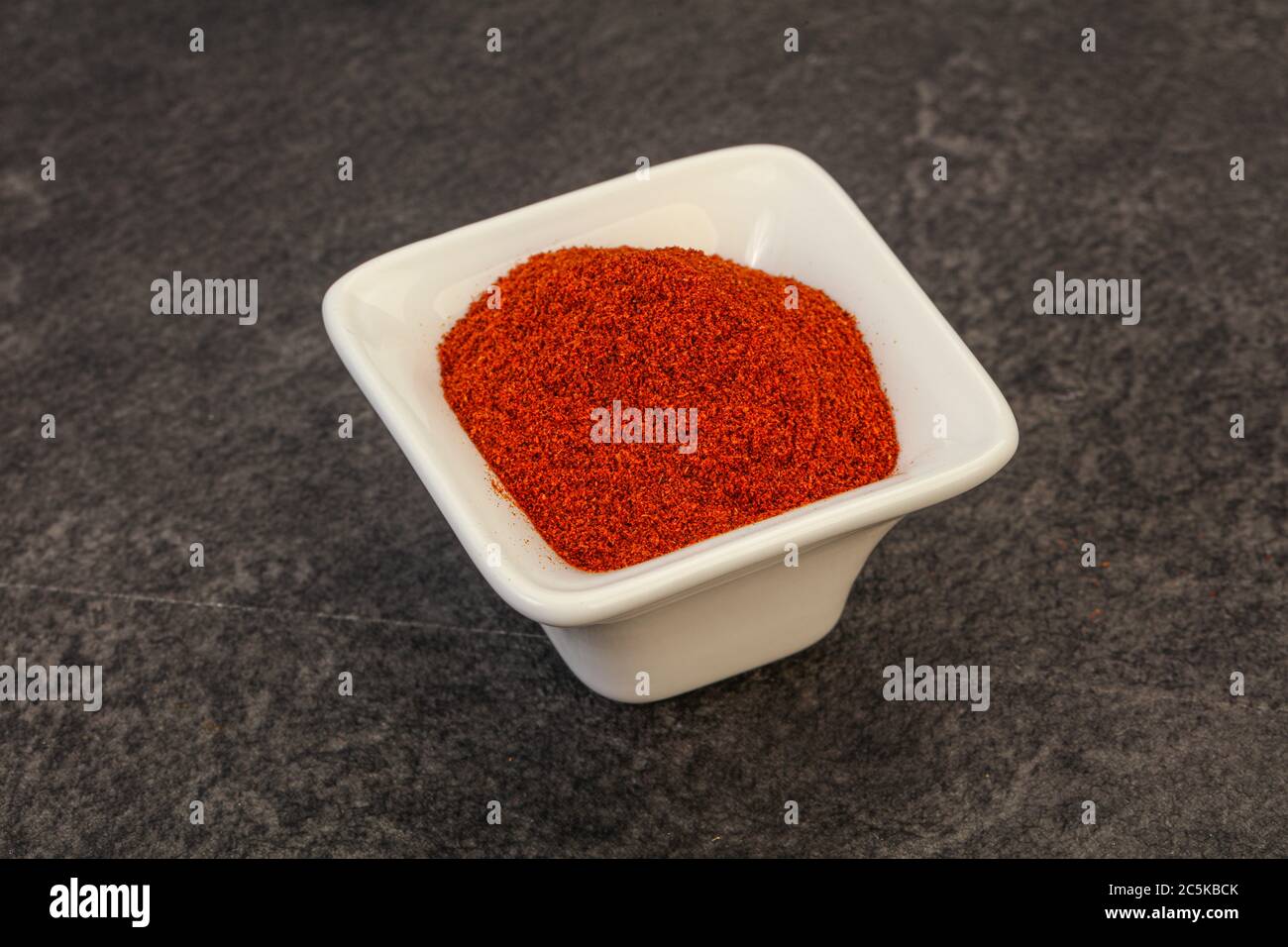 Dry paprika powder in the bowl for cooking Stock Photo - Alamy