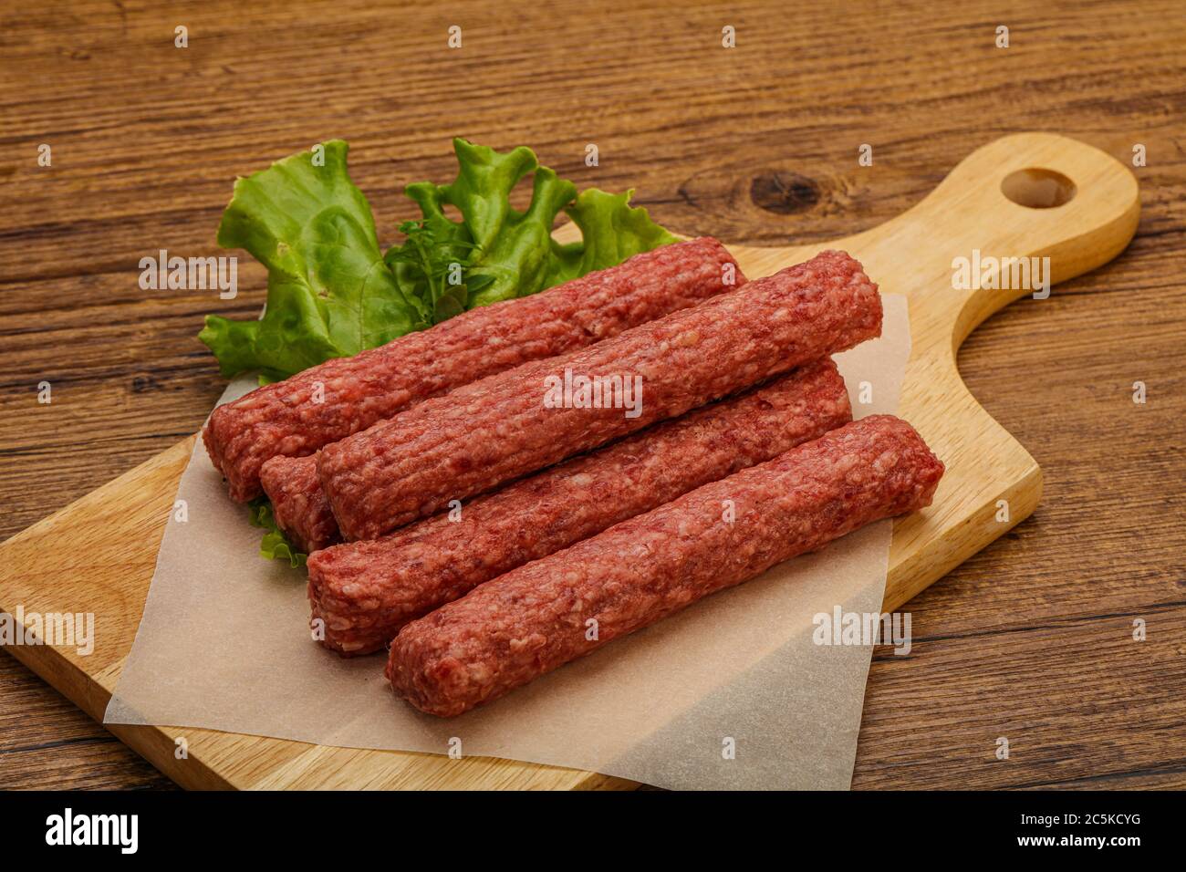 Raw beef sausages with spices for grill Stock Photo - Alamy