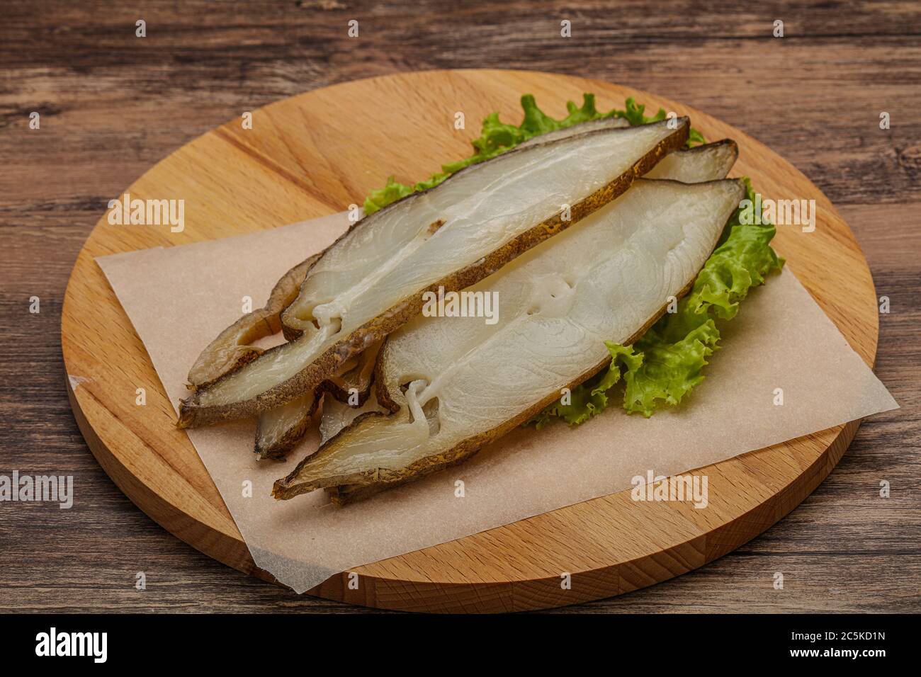 Delicous smoked halibut fish slices snack Stock Photo - Alamy