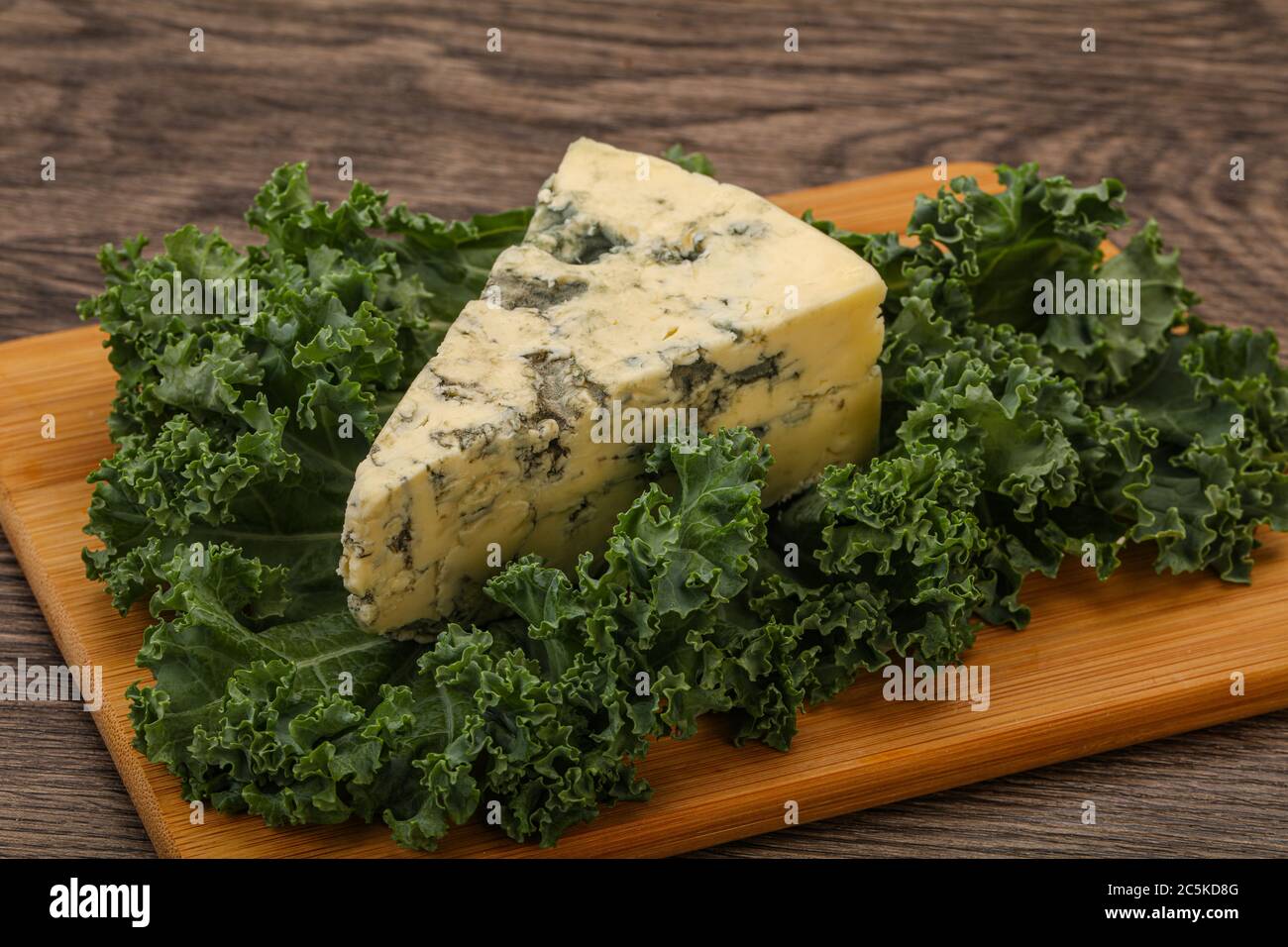Dairy Blue cheese triangle with mold Stock Photo - Alamy