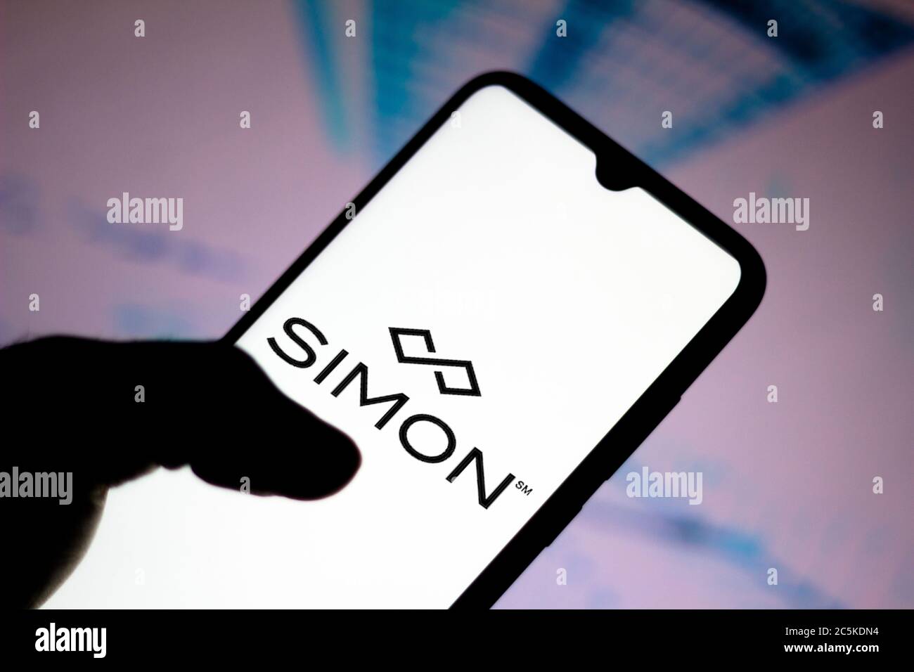 In this photo illustration the Simon Property Group logo seen displayed ...