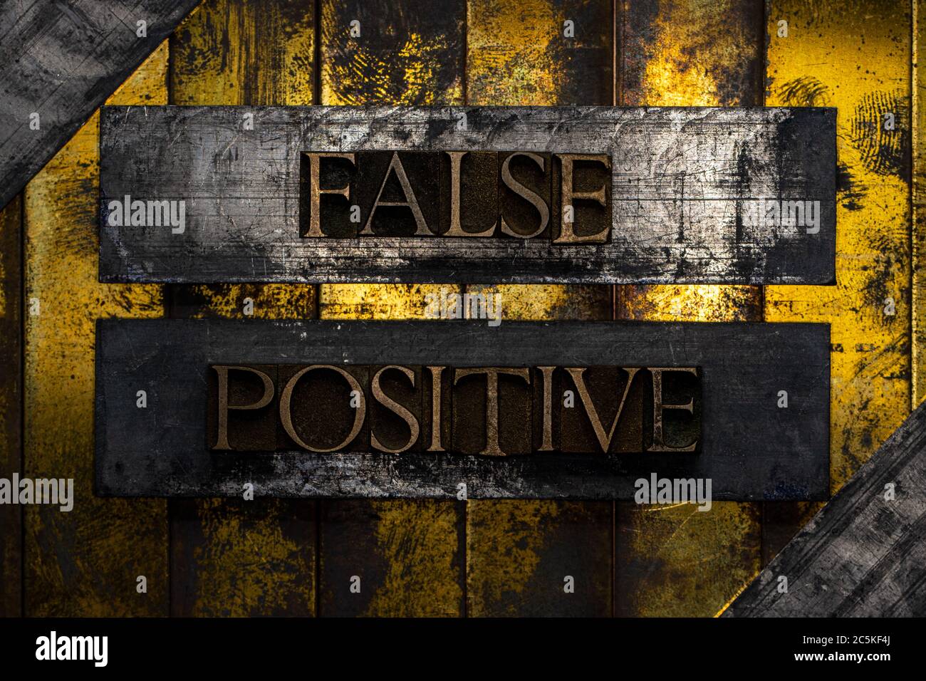 False Positive text formed with real authentic typeset letters on ...