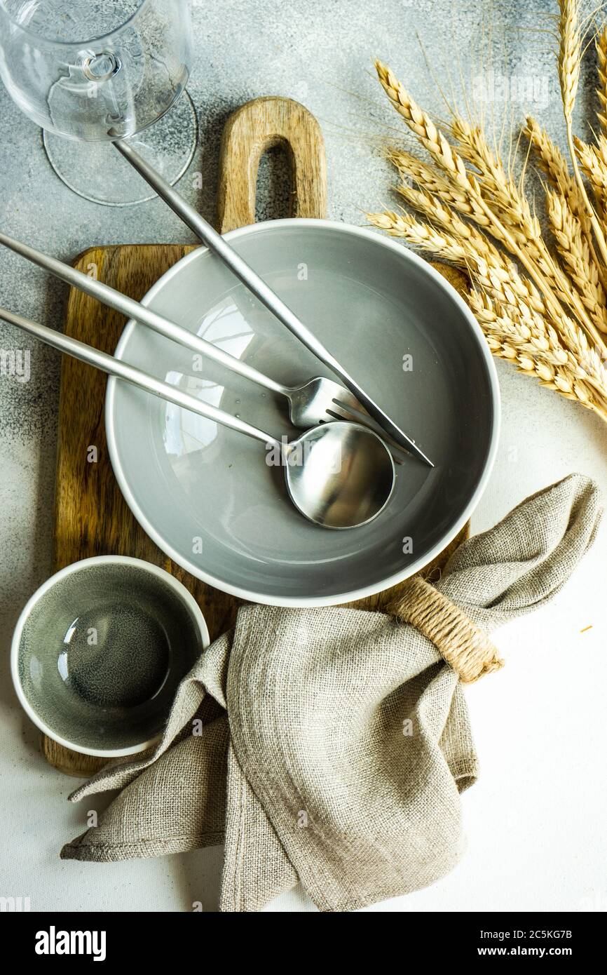Rustic table setting with cutlery decorated with whear ears on concrete ...
