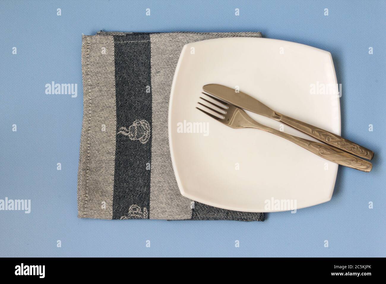 Table setting. Empty plate, knife, fork and napkin. Top view and flat ... Table setting. Empty plate, knife, fork and napkin. Top view and flat ...