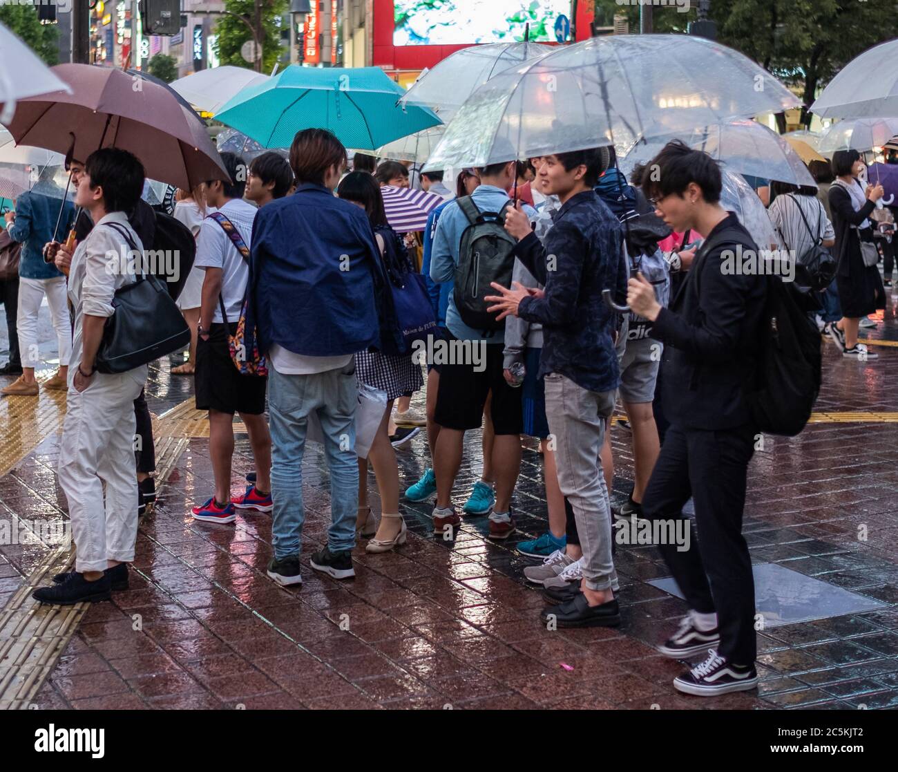 Pedestrian crowd with umbrellas at Hachiko Square, Tokyo, Japan during ...