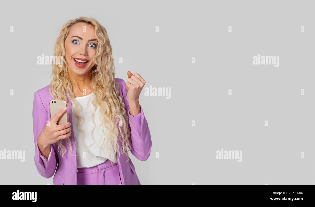 Woman holds smartphone arm hi-res stock photography and images - Alamy