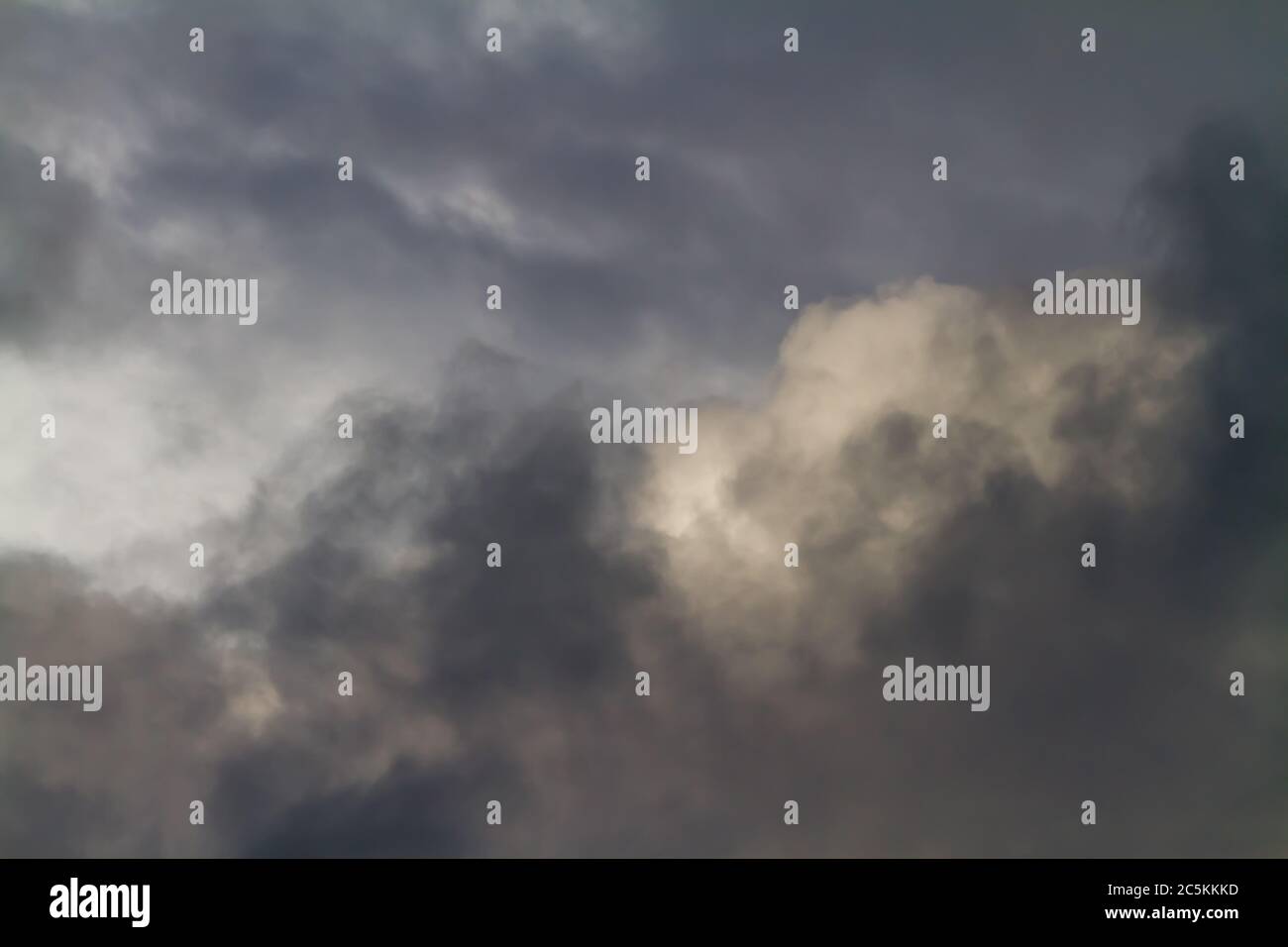 Dark storm clouds create a threatening sky as a thunderstorm approaches ...