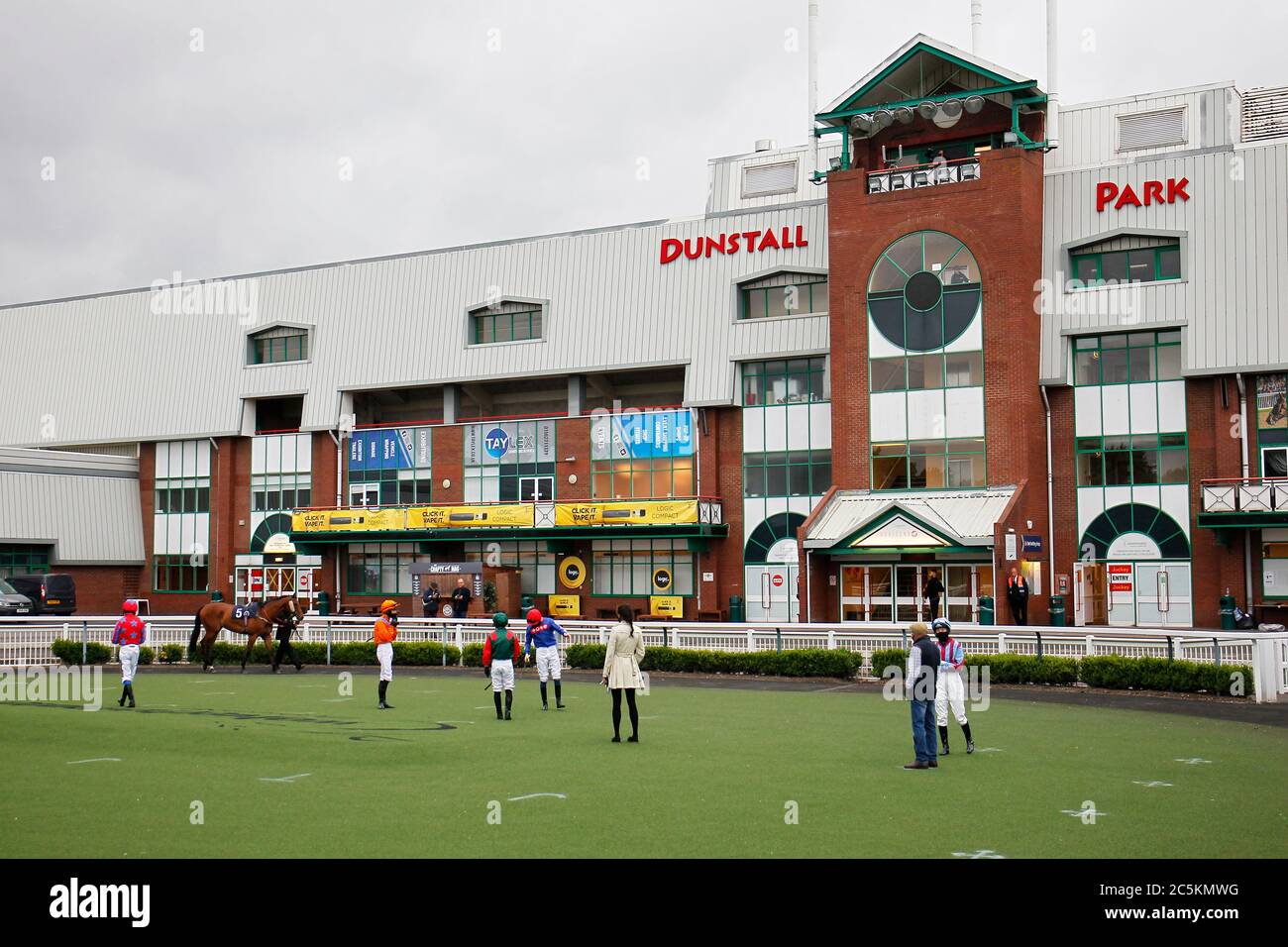 Jockeys and staff social distance in the parade ring at Wolverhampton ...