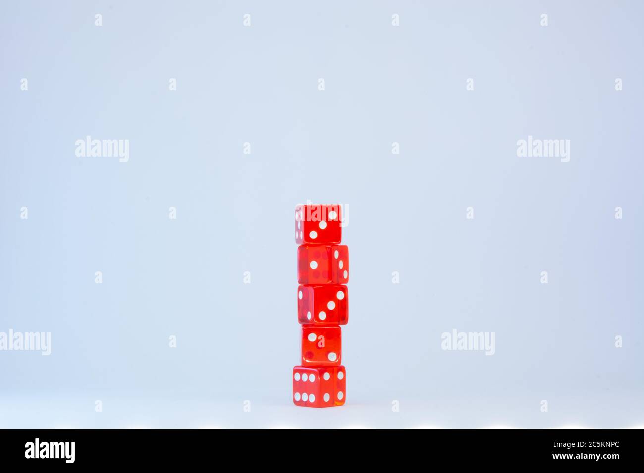 Big dice stacked one on top of another Stock Photo - Alamy