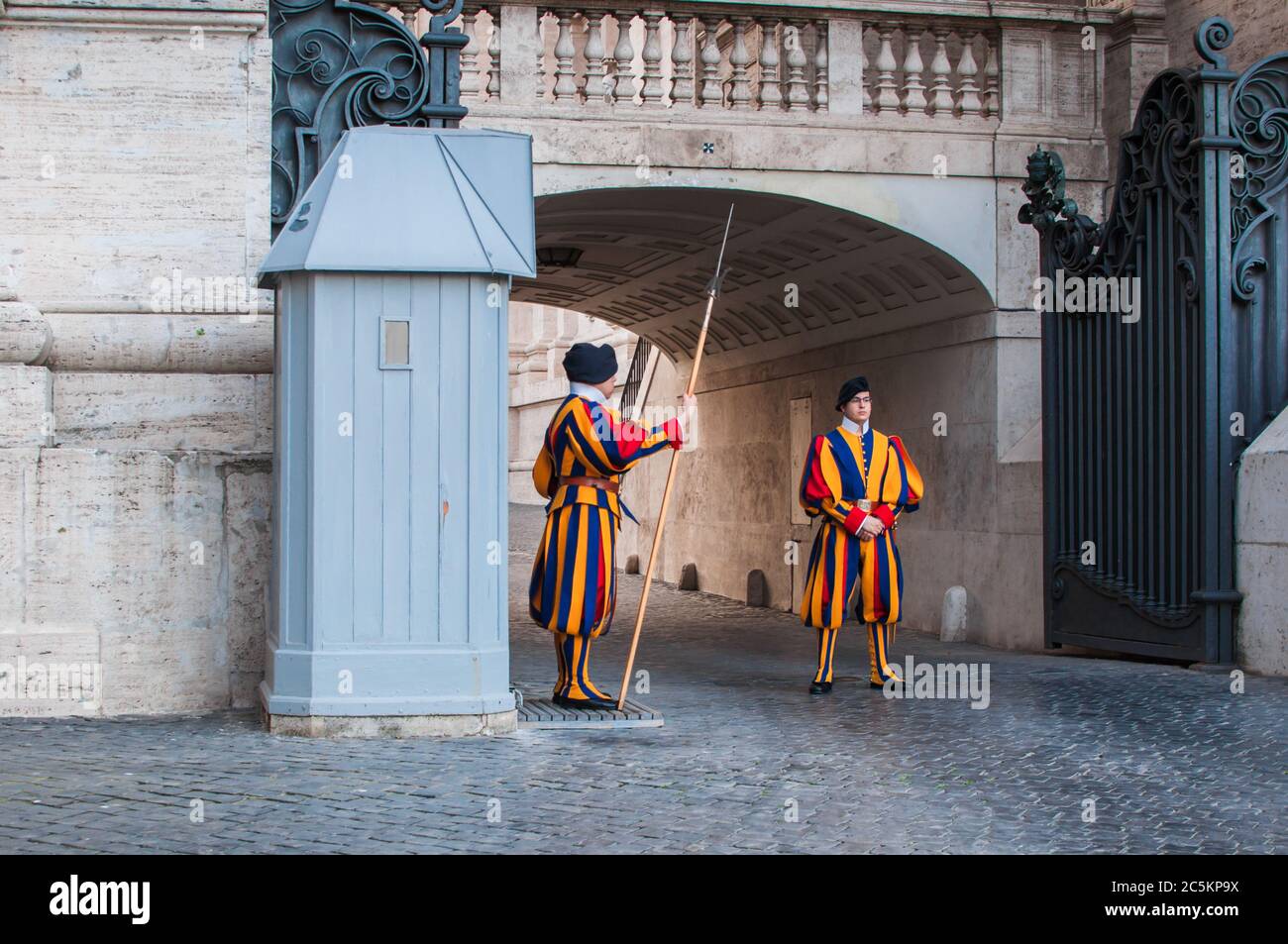 2 swiss guards are standing in at the entry near the Cathedrale in ...