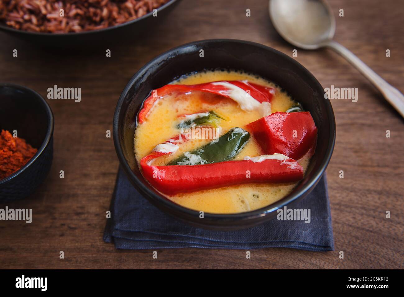 Bhutanese ema datsi with brown rice and eze spice Stock Photo - Alamy