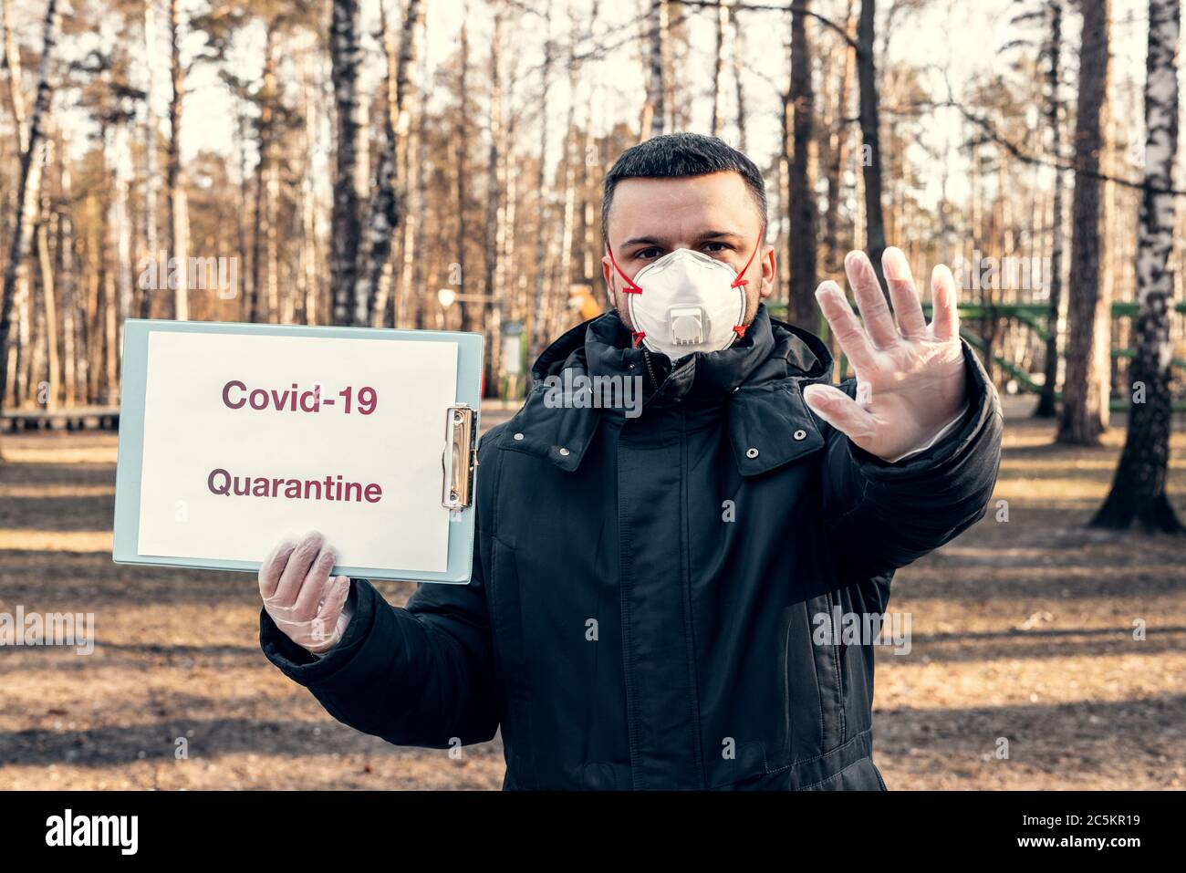 A man in a protective mask in an empty park. Quarantine and self ...