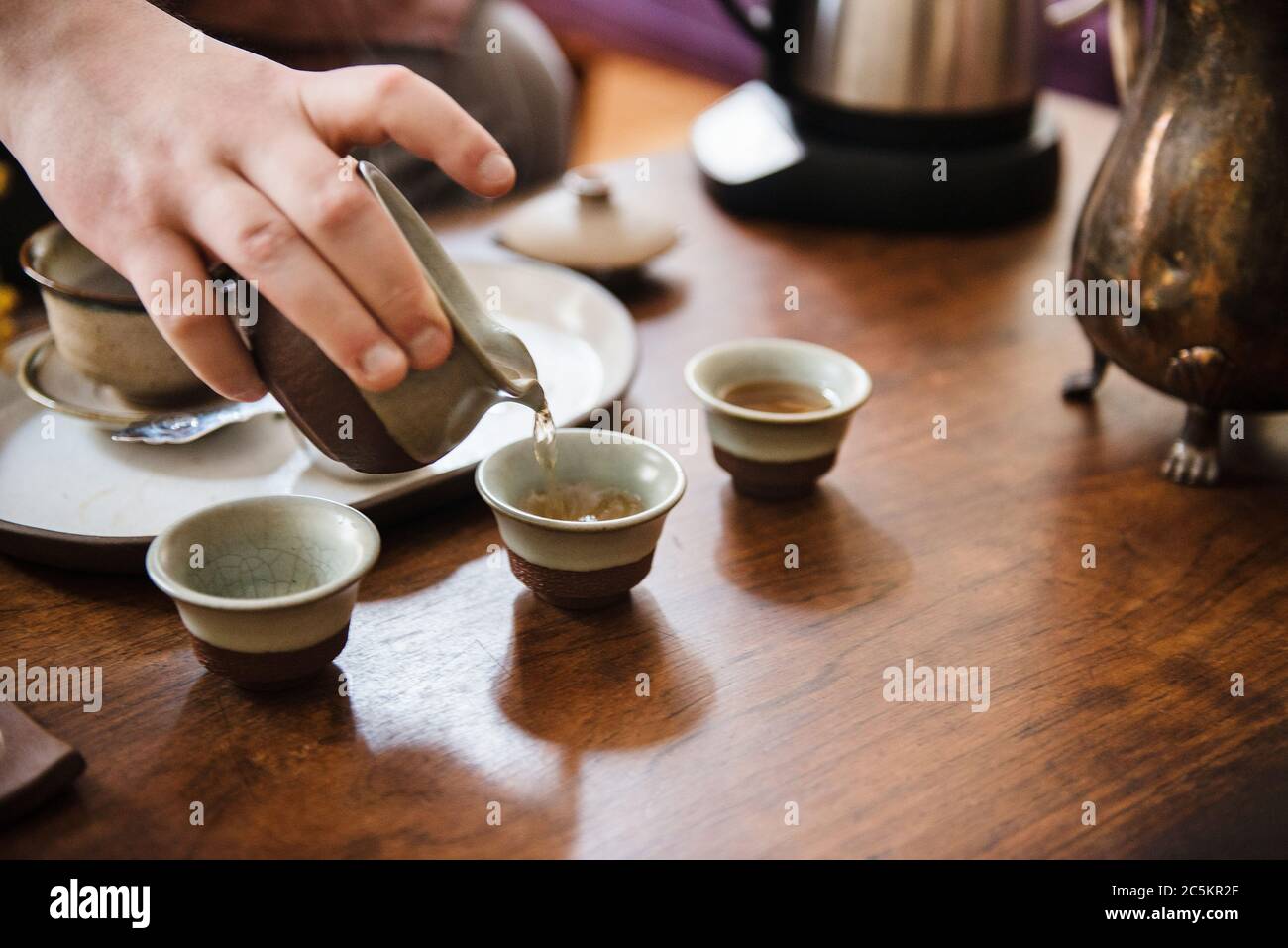 Oolong Tea being poured Stock Photo - Alamy