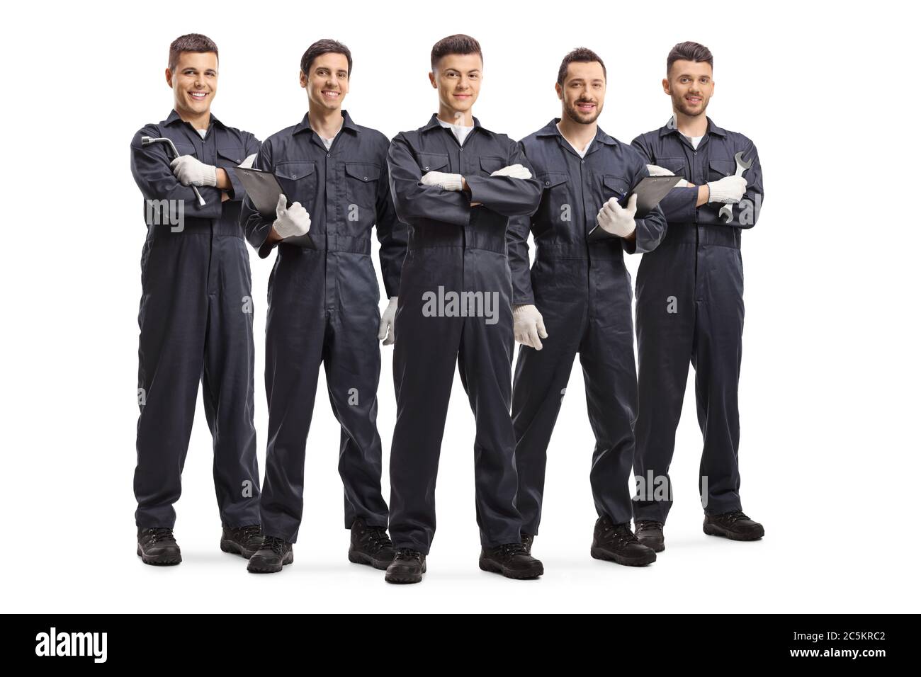 Team of five auto mechanic workers in uniforms isolated on white ...