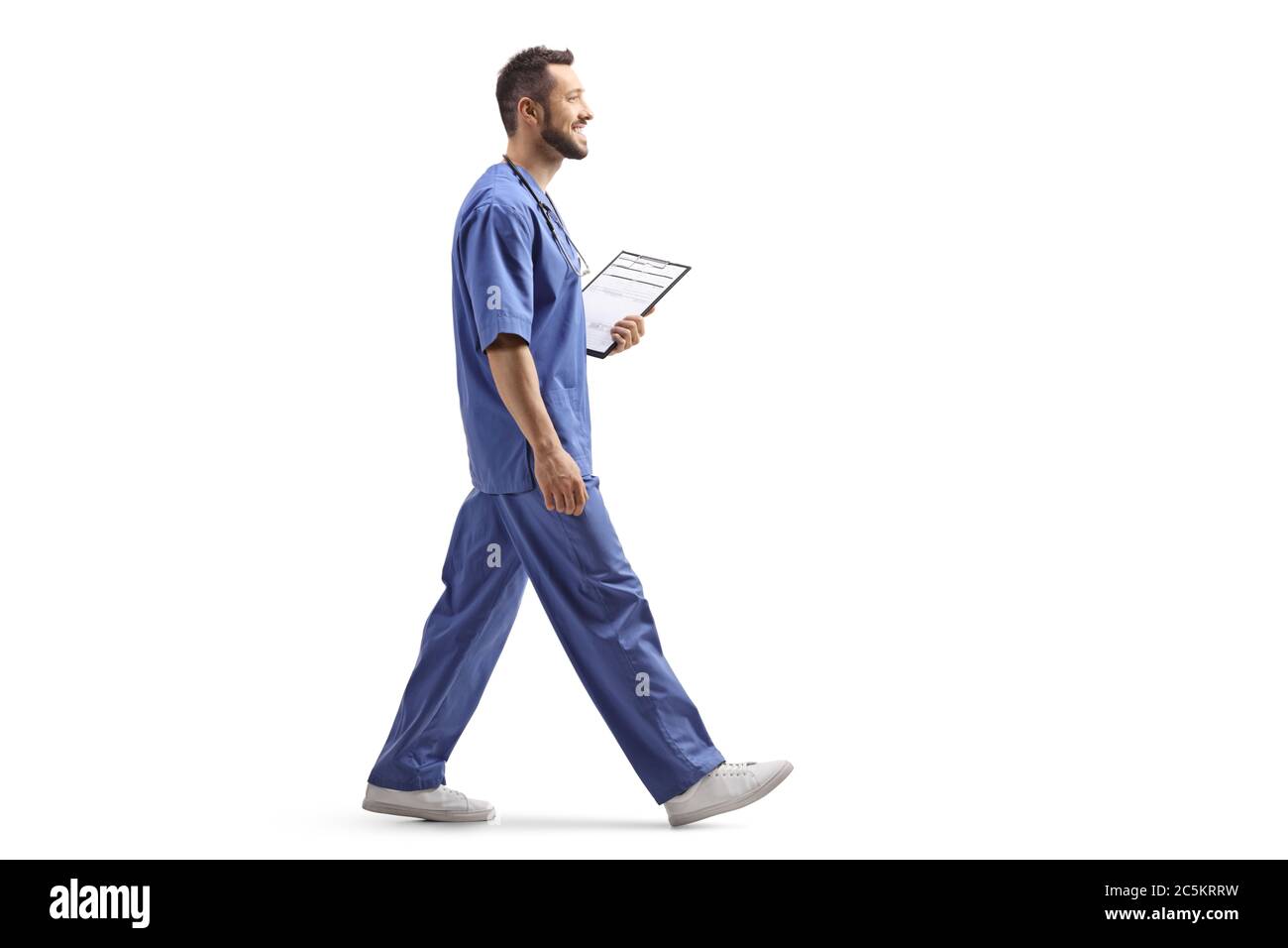 Full length profile shot of a male health worker in a blue uniform ...