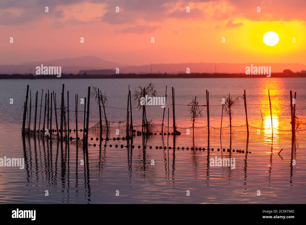 Sunset over Albufera freshwater lagoon and estuary on the Gulf of ...