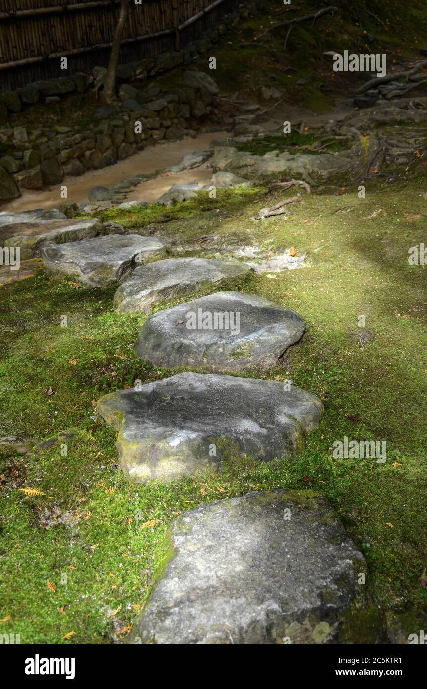Walking path made of big stones in a Japanese garden Stock Photo - Alamy
