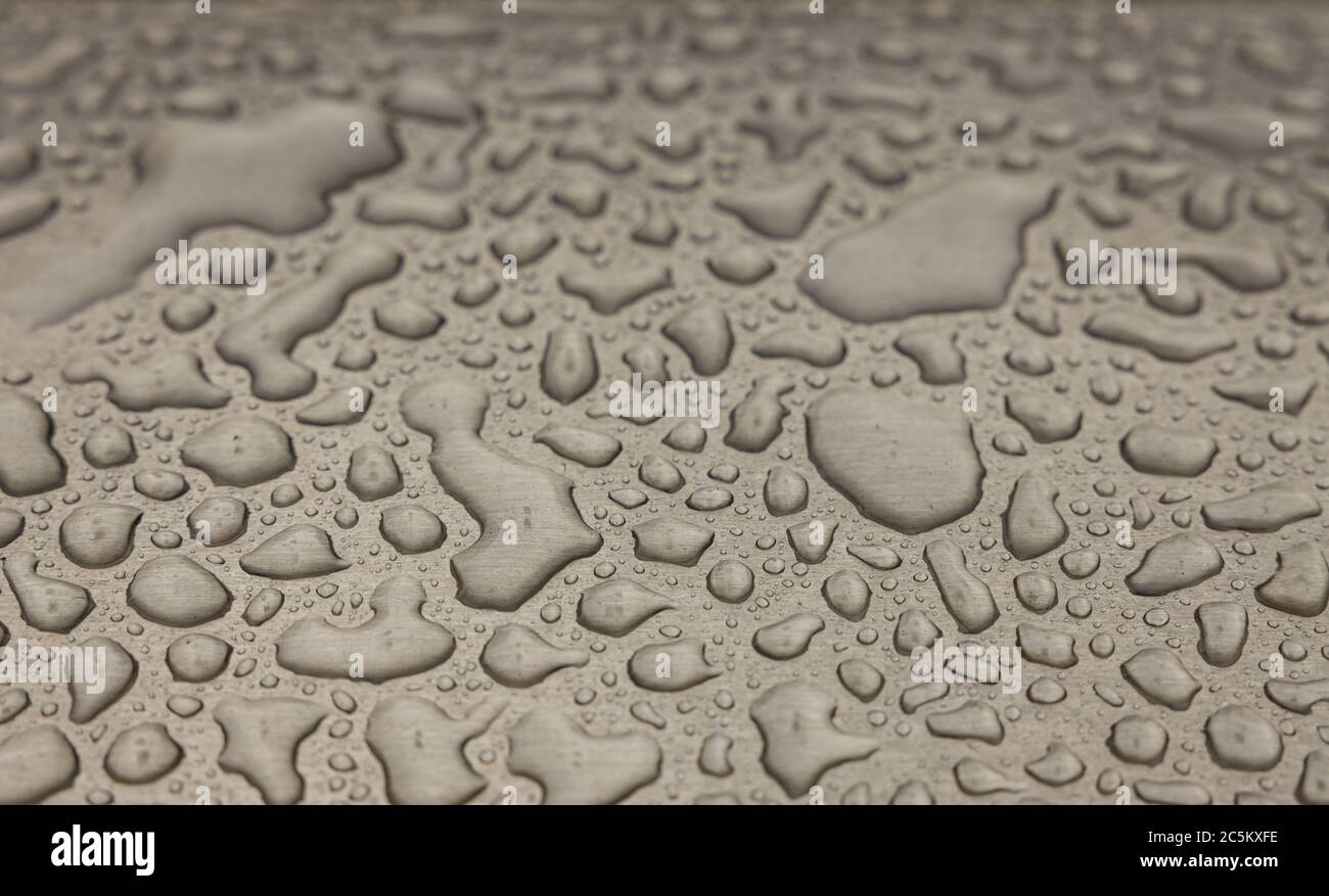 Beautiful background texture of rain water drops on grey black metal ...