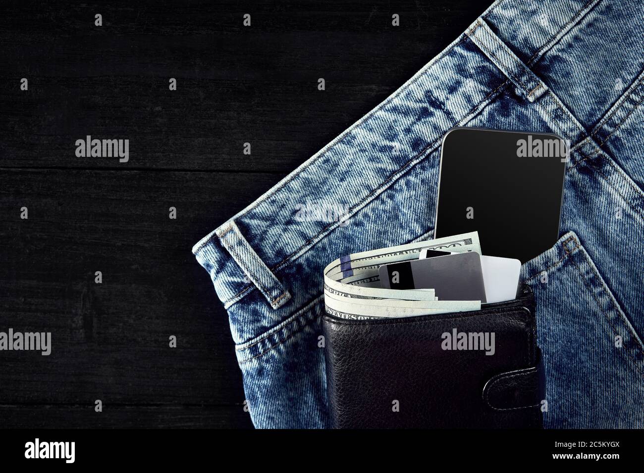Money, Smart, Debit card and Credit card are in pocket of blue jean on ...