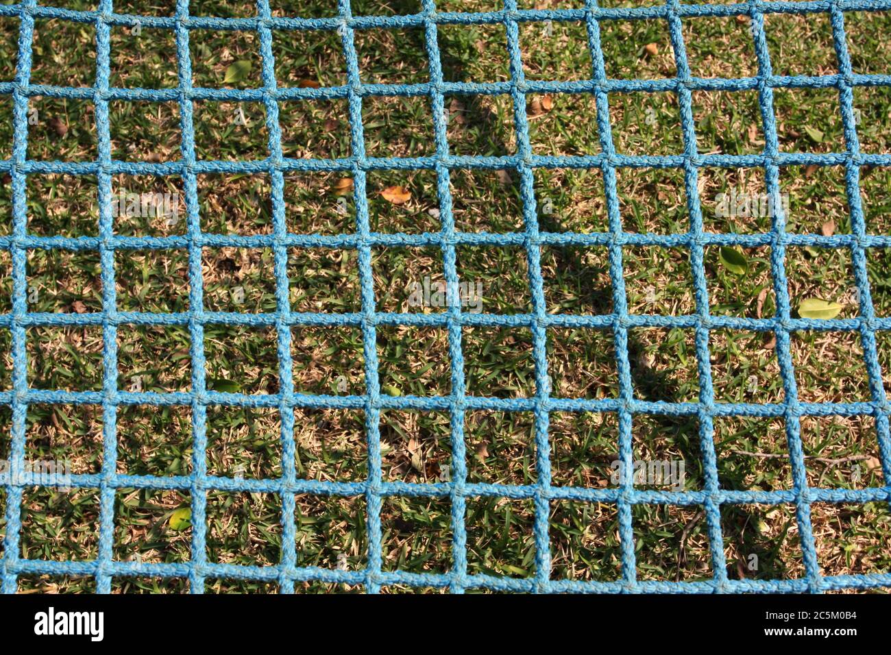 Heavycatch net with rope squares & grass underneath Stock Photo - Alamy