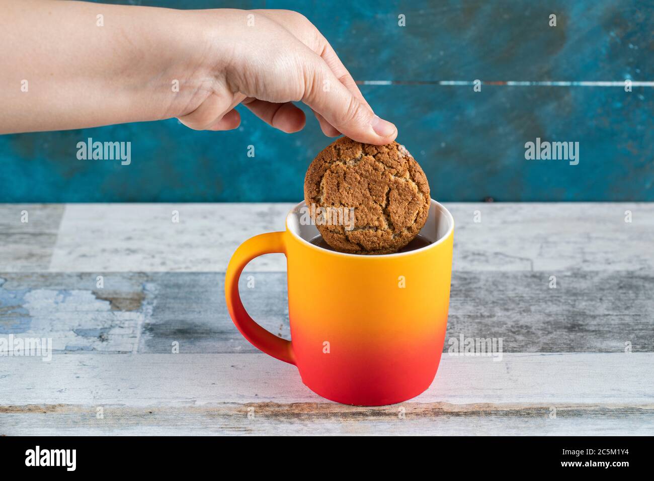 Dipping biscuit into tea hi-res stock photography and images - Alamy