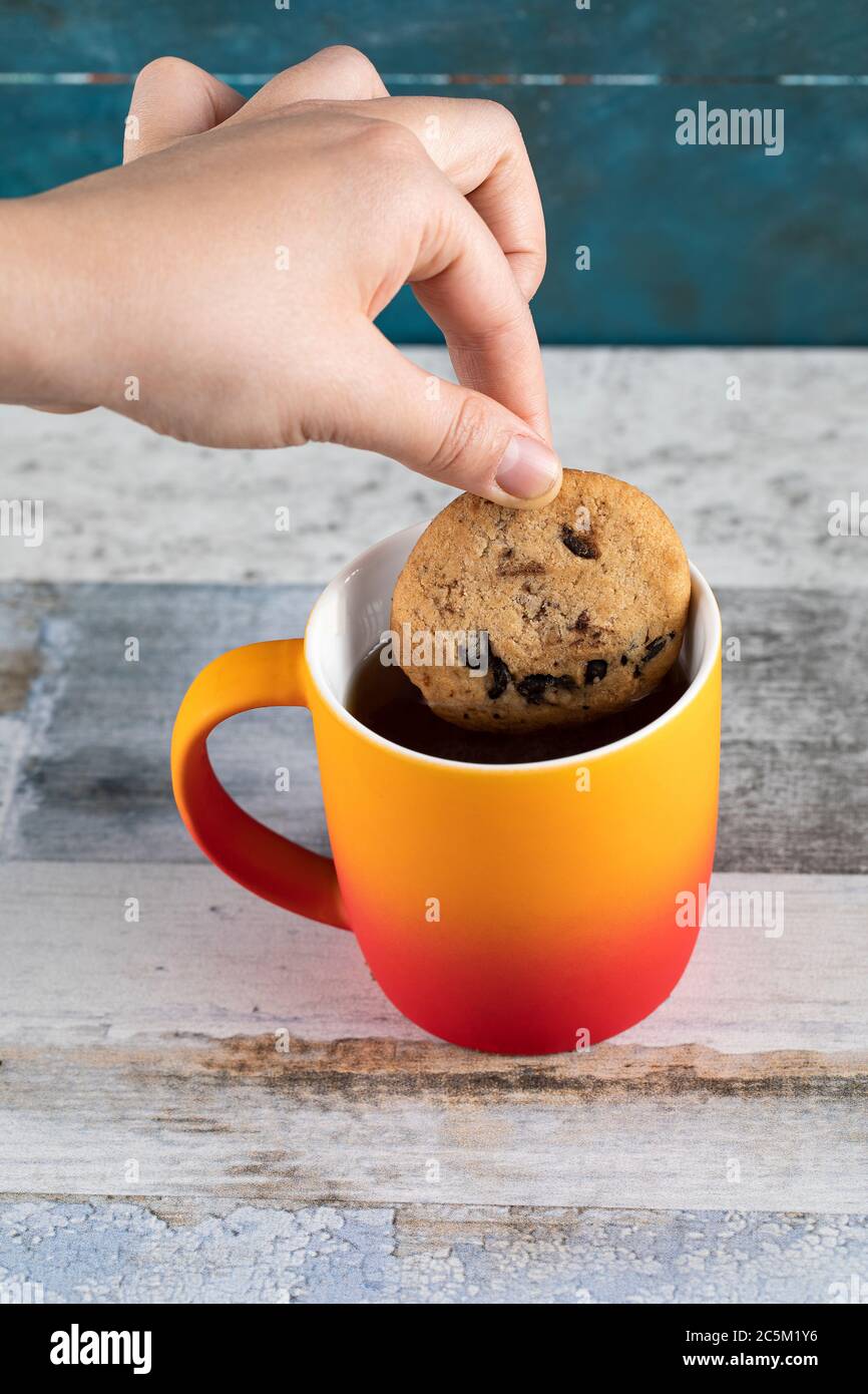 Dipping biscuit into tea hi-res stock photography and images - Alamy